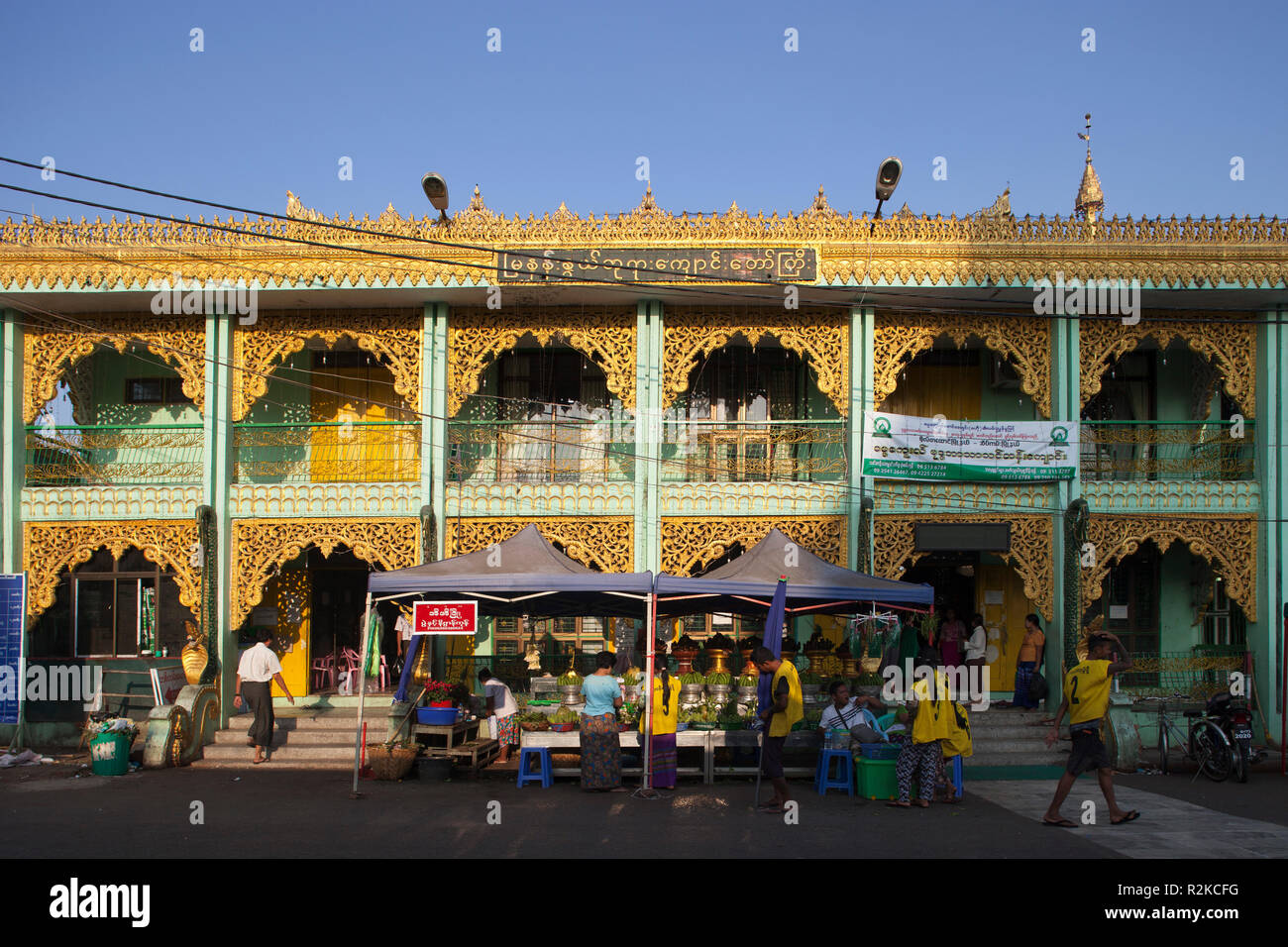 Traditional building and sellers in front of Botataung paya, Yangon ...