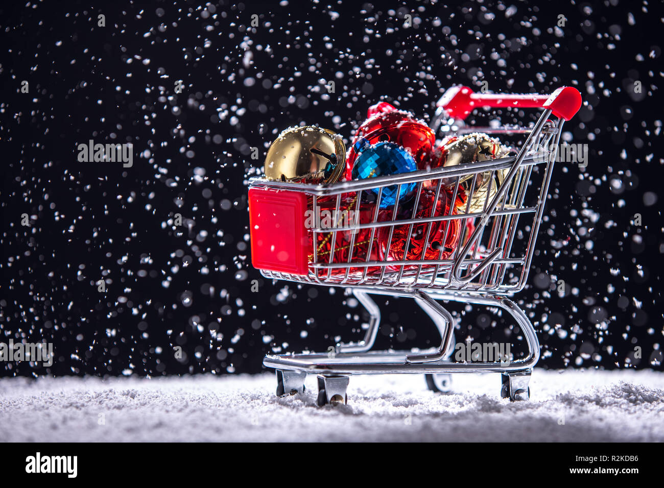 Shopping cart and snowflakes isolated. Christmas shopping background ...