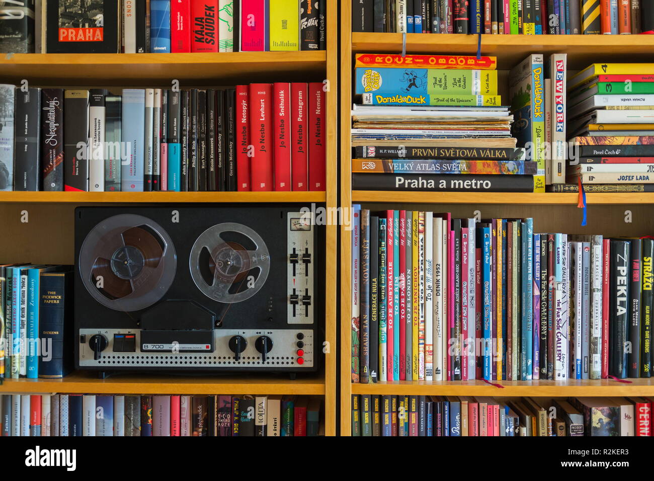 Vintage reel-to-reel magnetic tape audio recorder in library full of ...