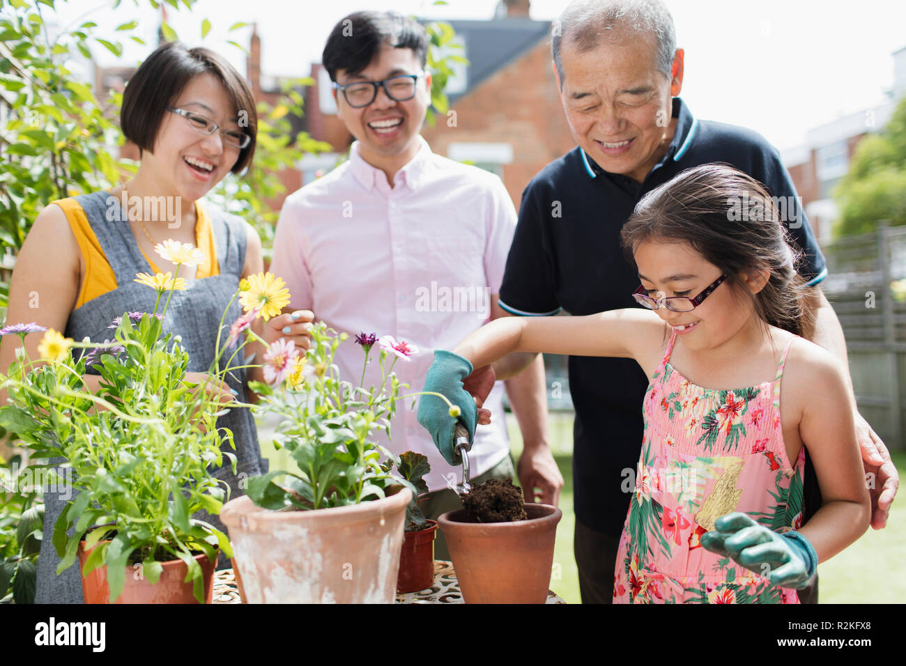 Daughter helping mother gardening hi-res stock photography and images ...