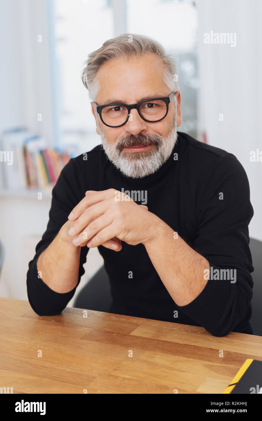 Portrait Of A Middle Aged Bearded Man Wearing Eyeglasses While Looking