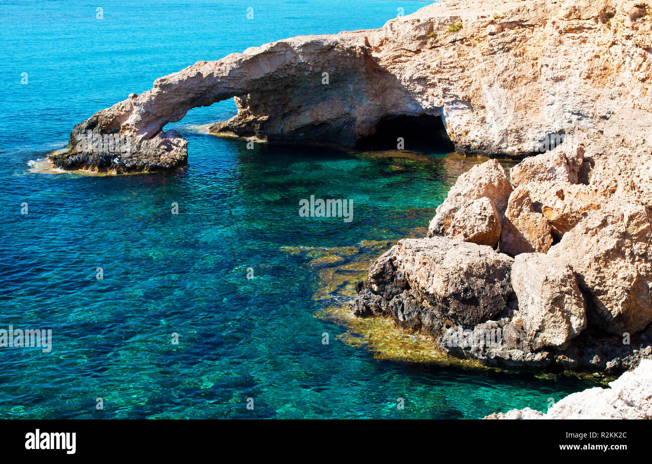 Clouseup of Agia Napa, Cyprus, natural landmark Love Bridge. Yellow ...
