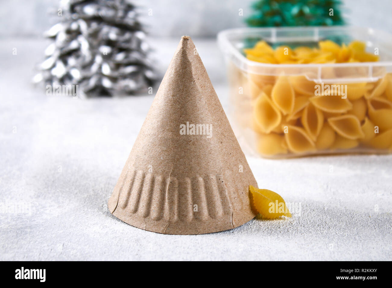 How to make a Christmas tree from raw pasta conchiglie. The process of ...