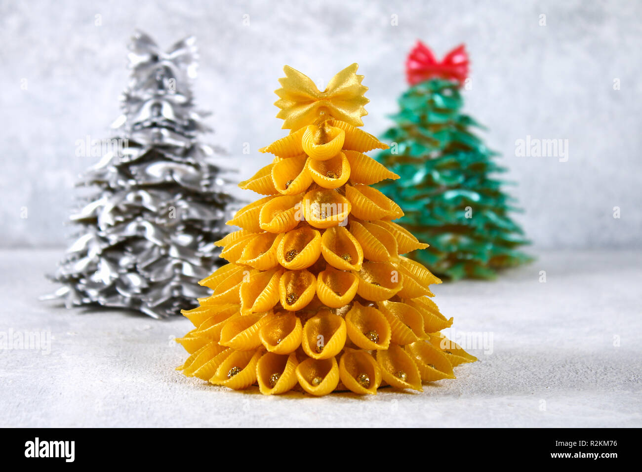 How to make a Christmas tree from raw pasta conchiglie. The process of ...