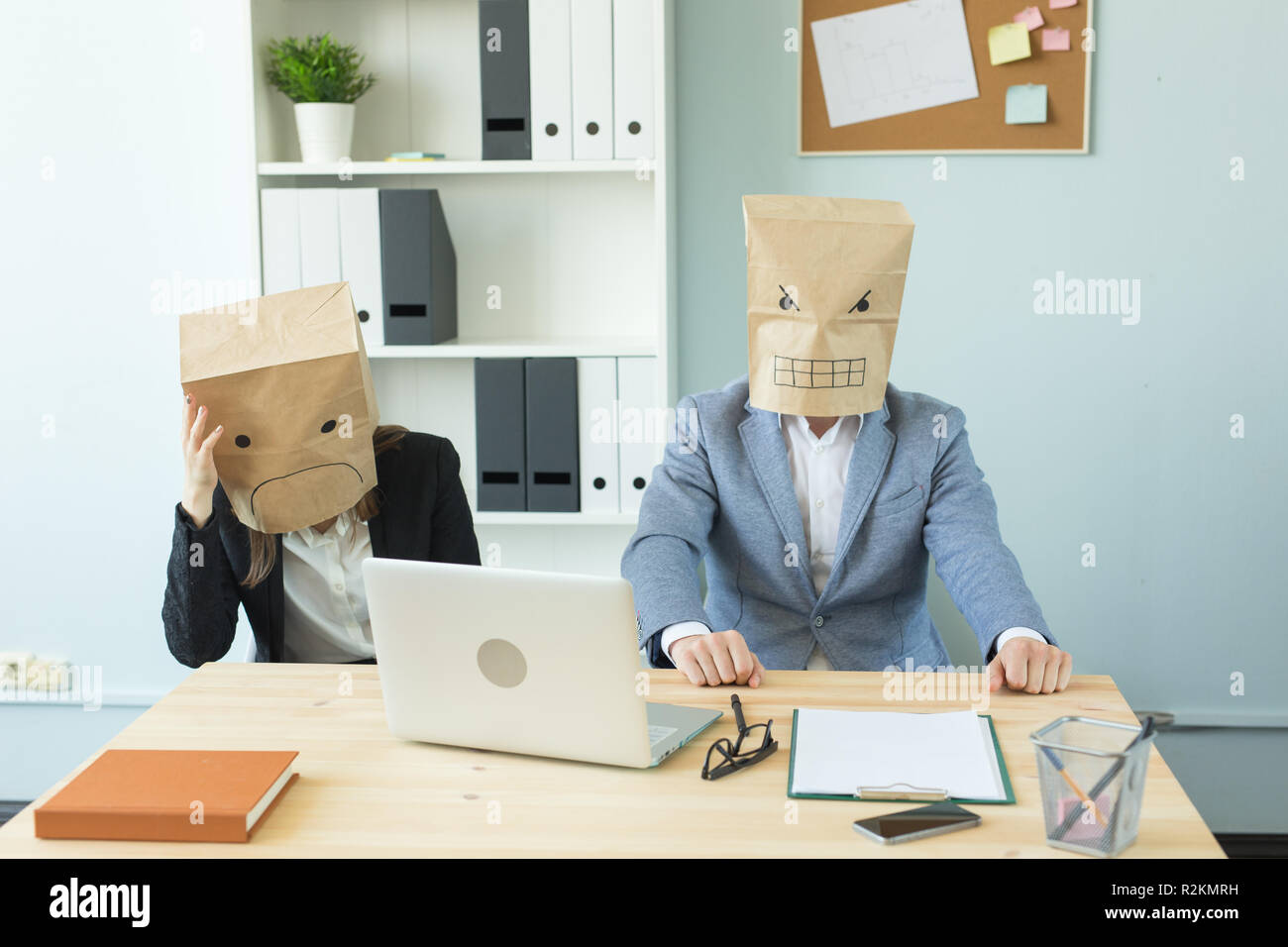 Business, emotions and people concept - Two angry and exhausted workers ...