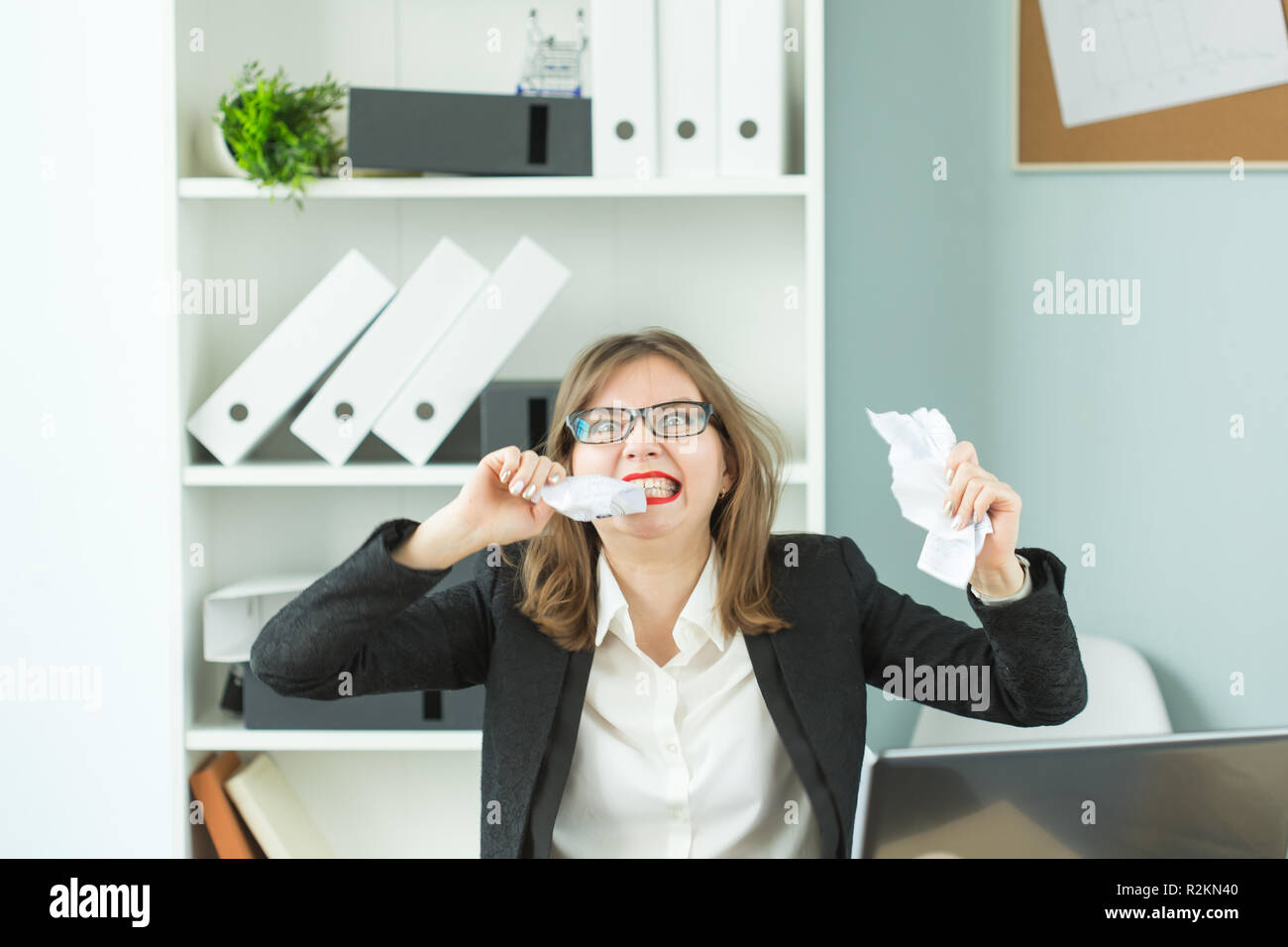 Stress, office and people concept - a woman, worker with a lot of work ...