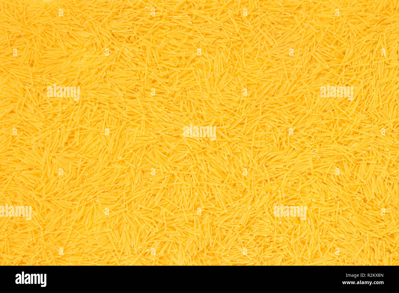 Uncooked soup noodles. Bright yellow food background Stock Photo - Alamy