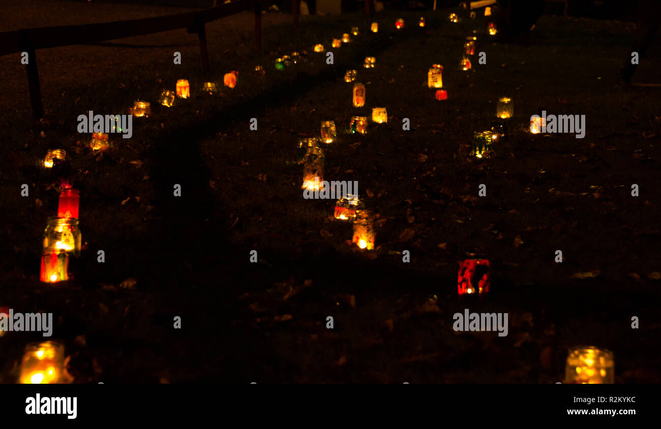 Candles placed on the ground to show the way in the dark Stock Photo ...