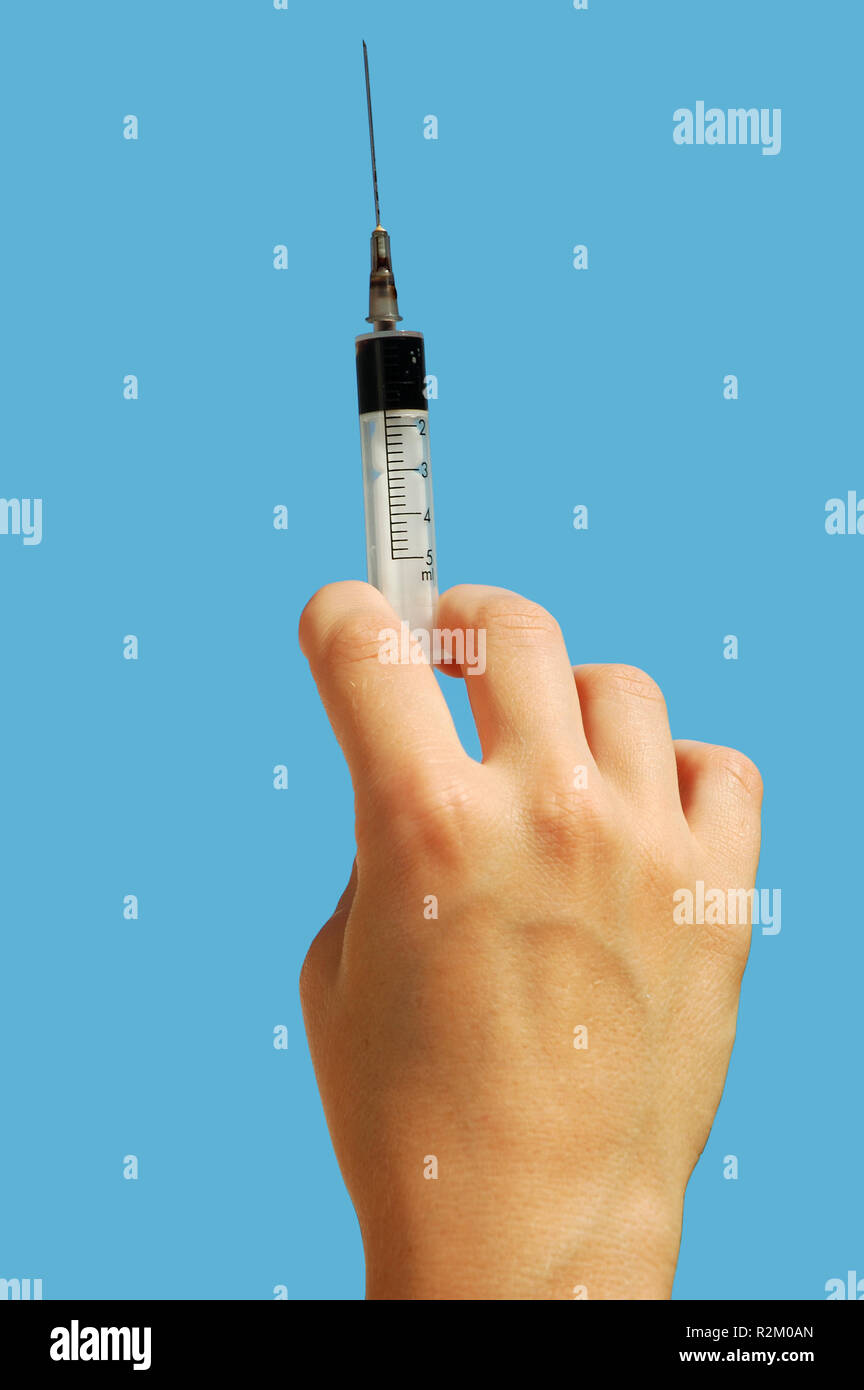 hand with syringe Stock Photo - Alamy