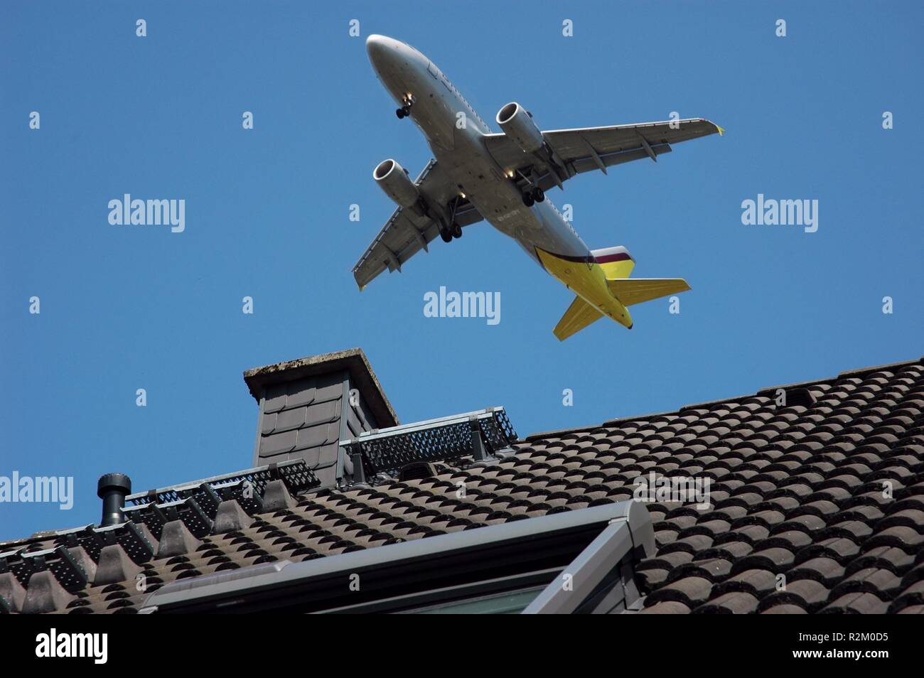 airplane over the city Stock Photo - Alamy