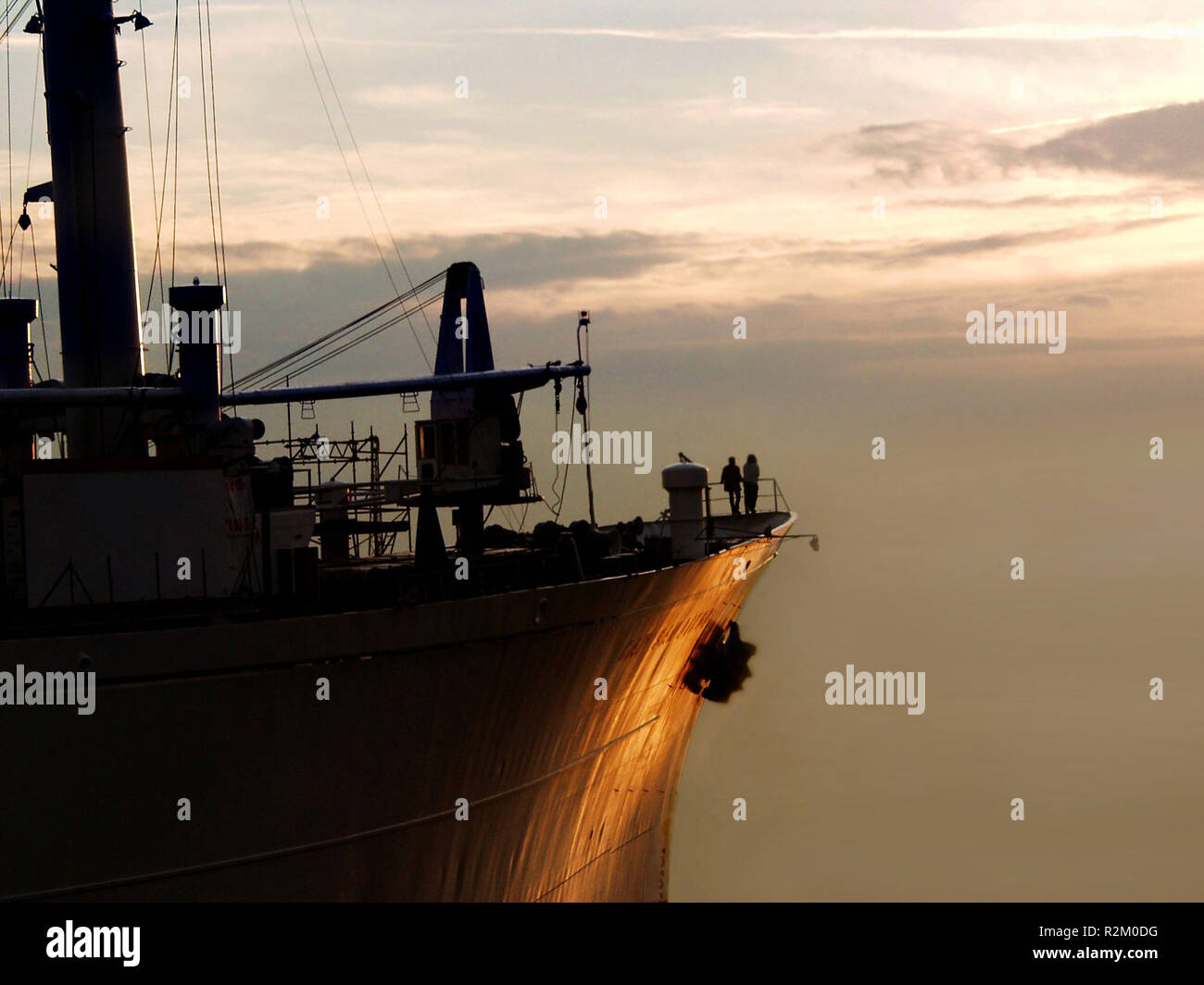 Sailboat leaving harbor at sunset hi-res stock photography and images ...