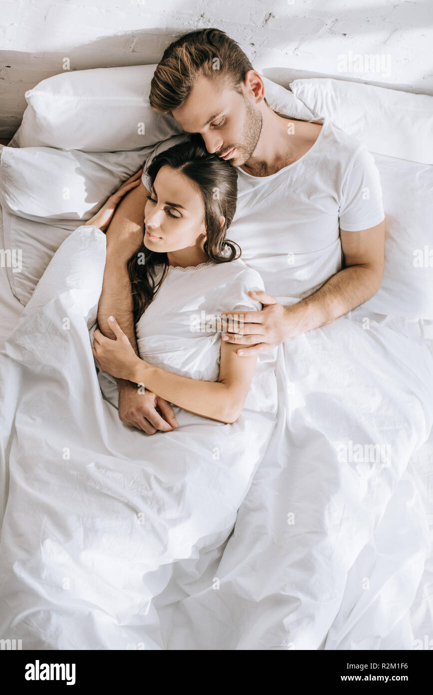 Top view young couple sleeping hi-res stock photography and images - Alamy