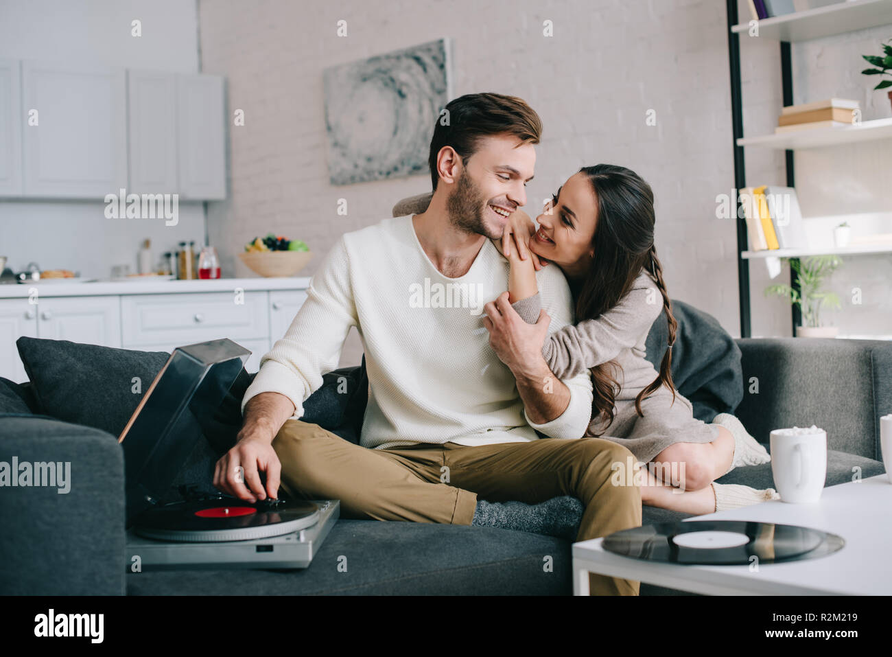 Young couple listening vinyl hi-res stock photography and images - Alamy