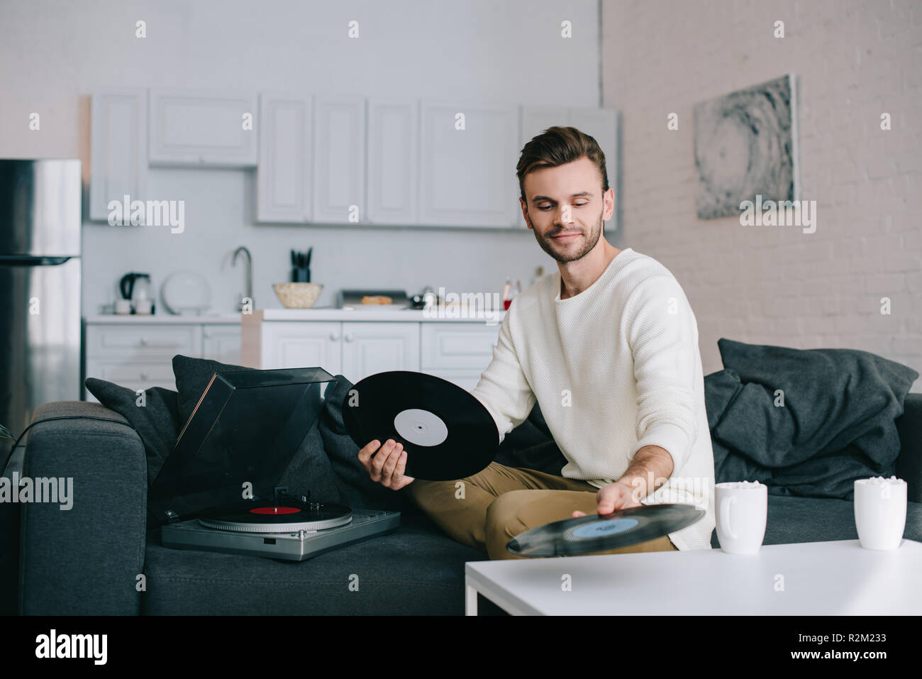 Man playing record player hi-res stock photography and images - Alamy