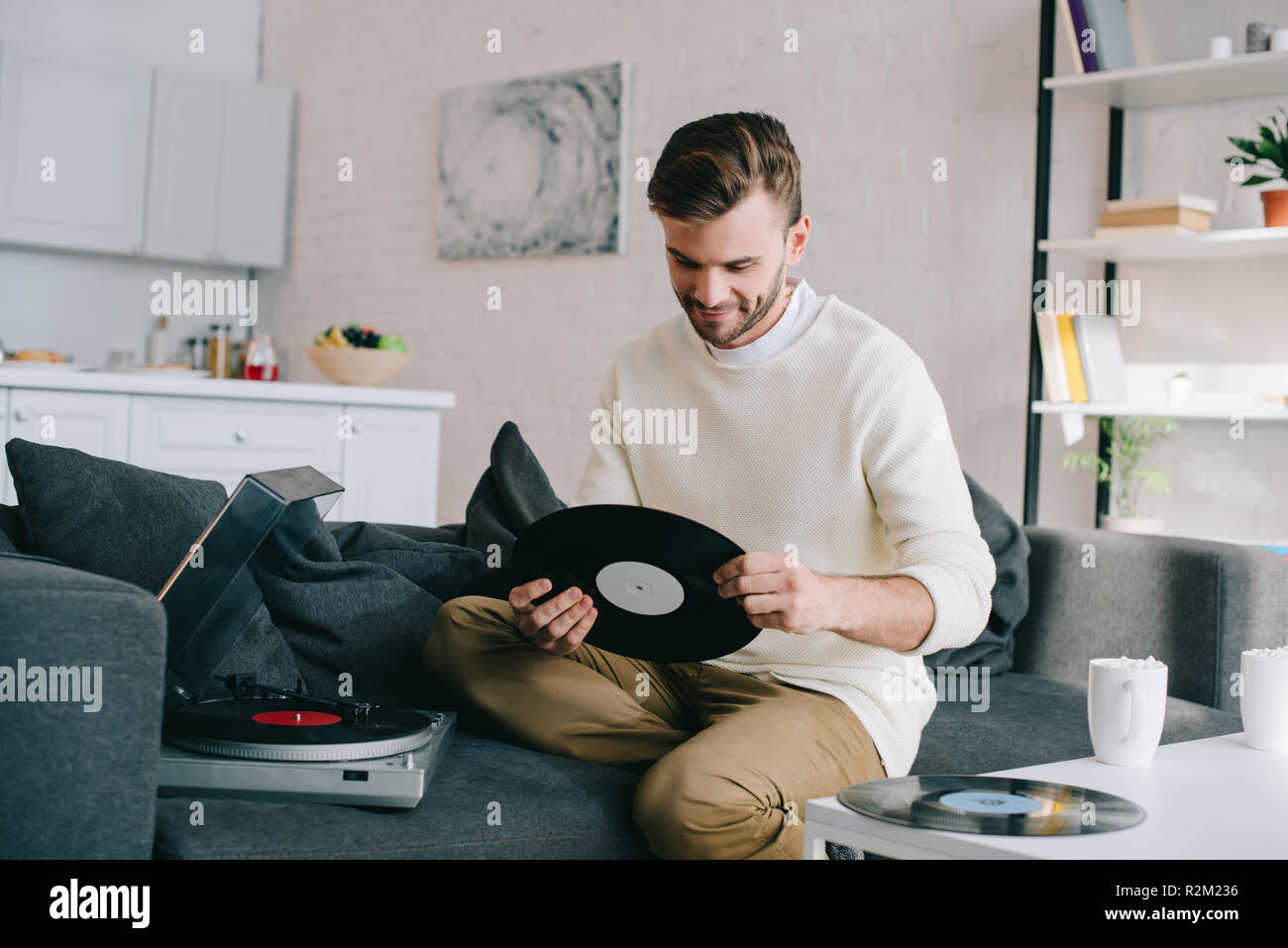Man playing record player hi-res stock photography and images - Alamy