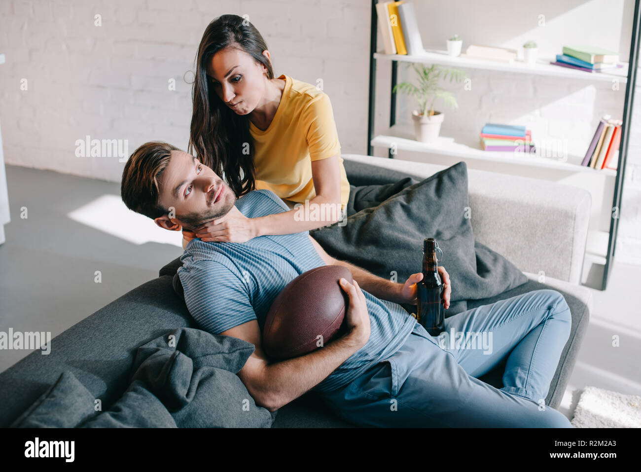 Angry couple watching tv hi-res stock photography and images - Alamy