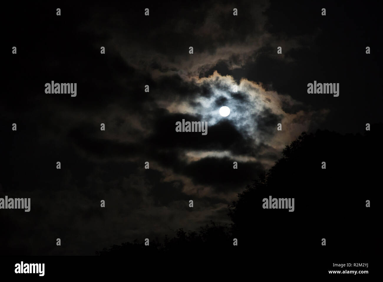 Moon shining through the clouds hi-res stock photography and images - Alamy