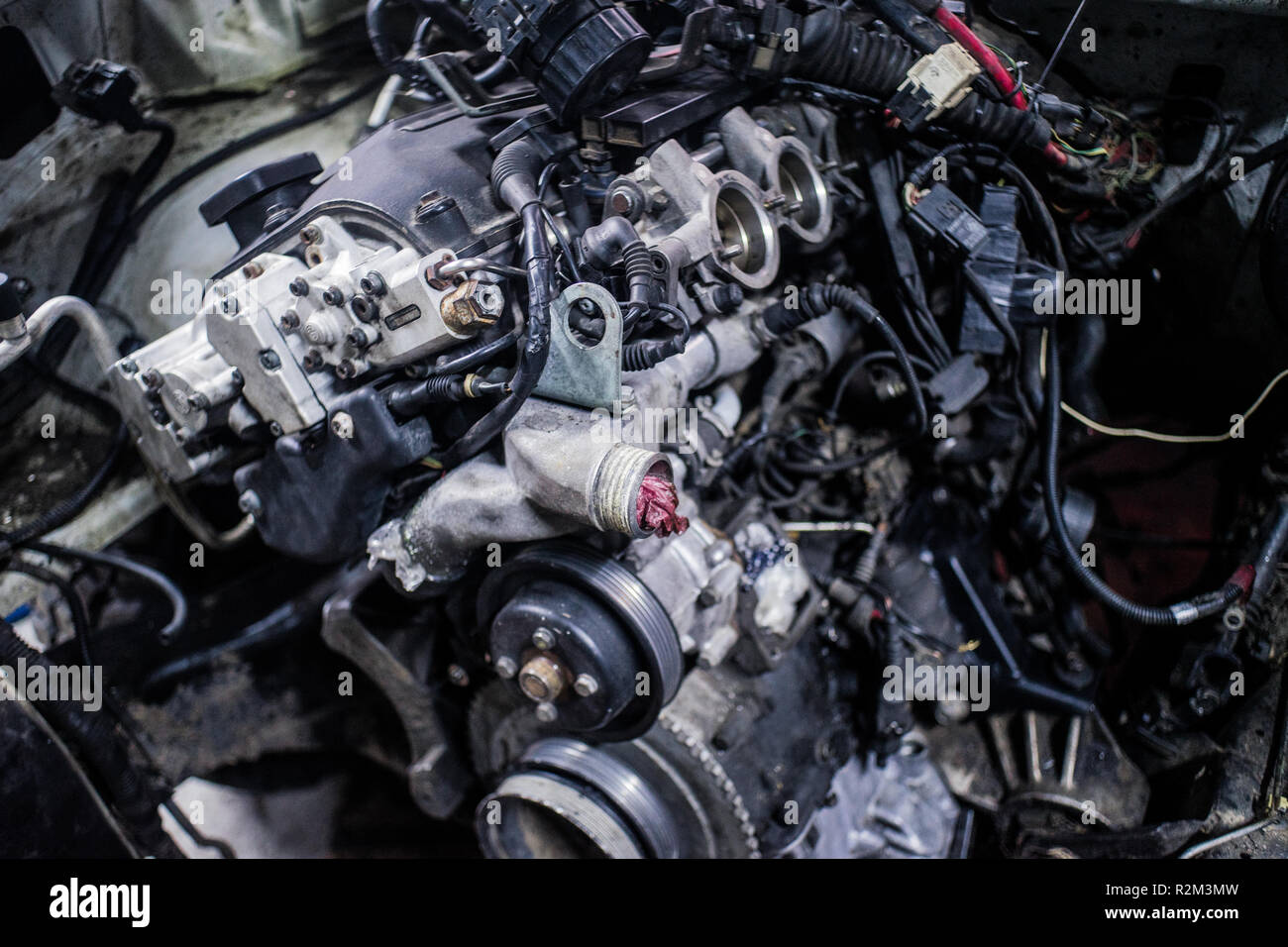 Legendary modern sport engine in car with open hood and raw parts Stock ...