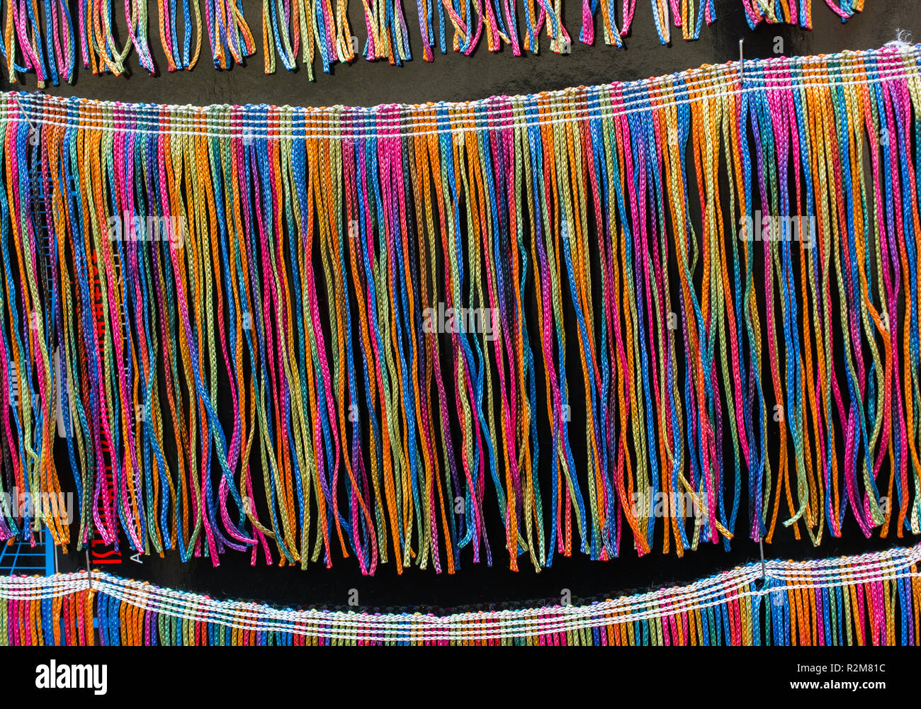 Lots of colorful braided strings in the view Stock Photo - Alamy