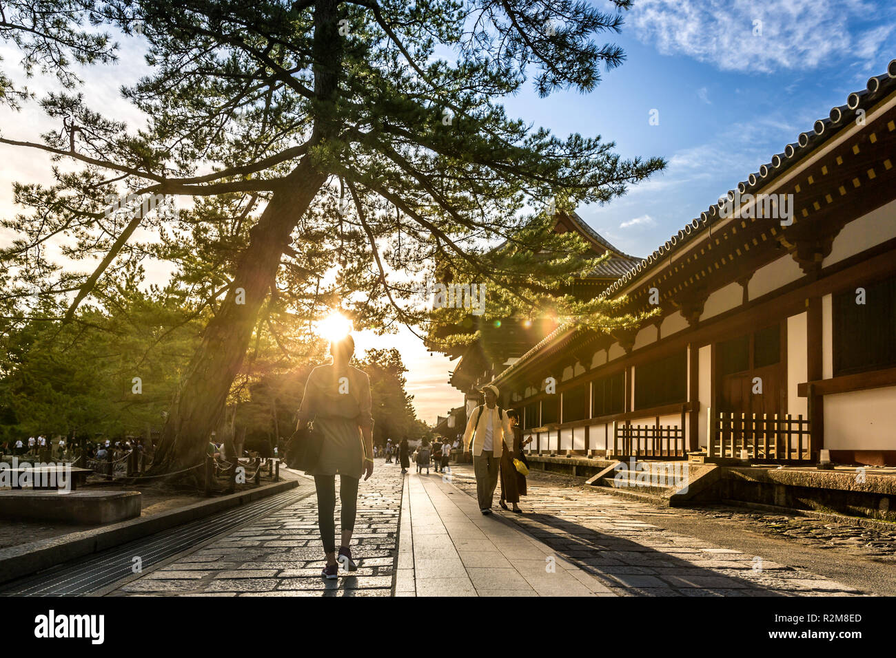 Nara, Japan - Sep 18th 2018 - Locals and Tourists walking in the sunset ...