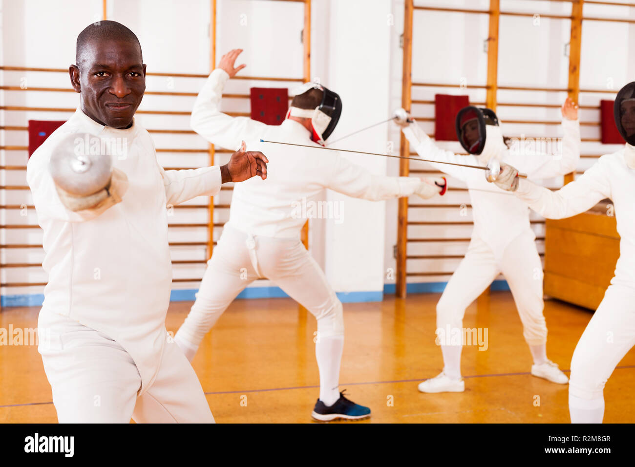 Sporty african american man fencer practicing effective fencing ...