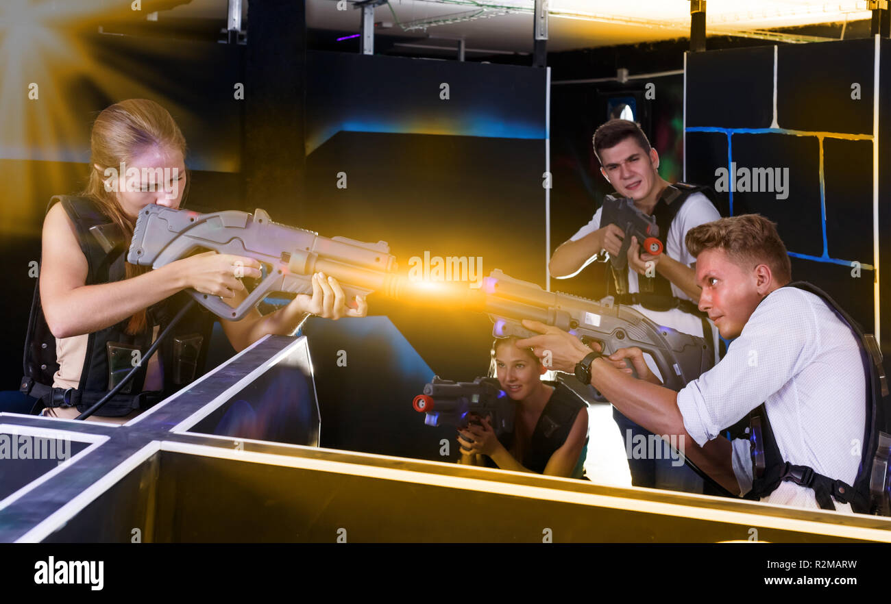 Two exciting players man and girl standing opposite each other with ...