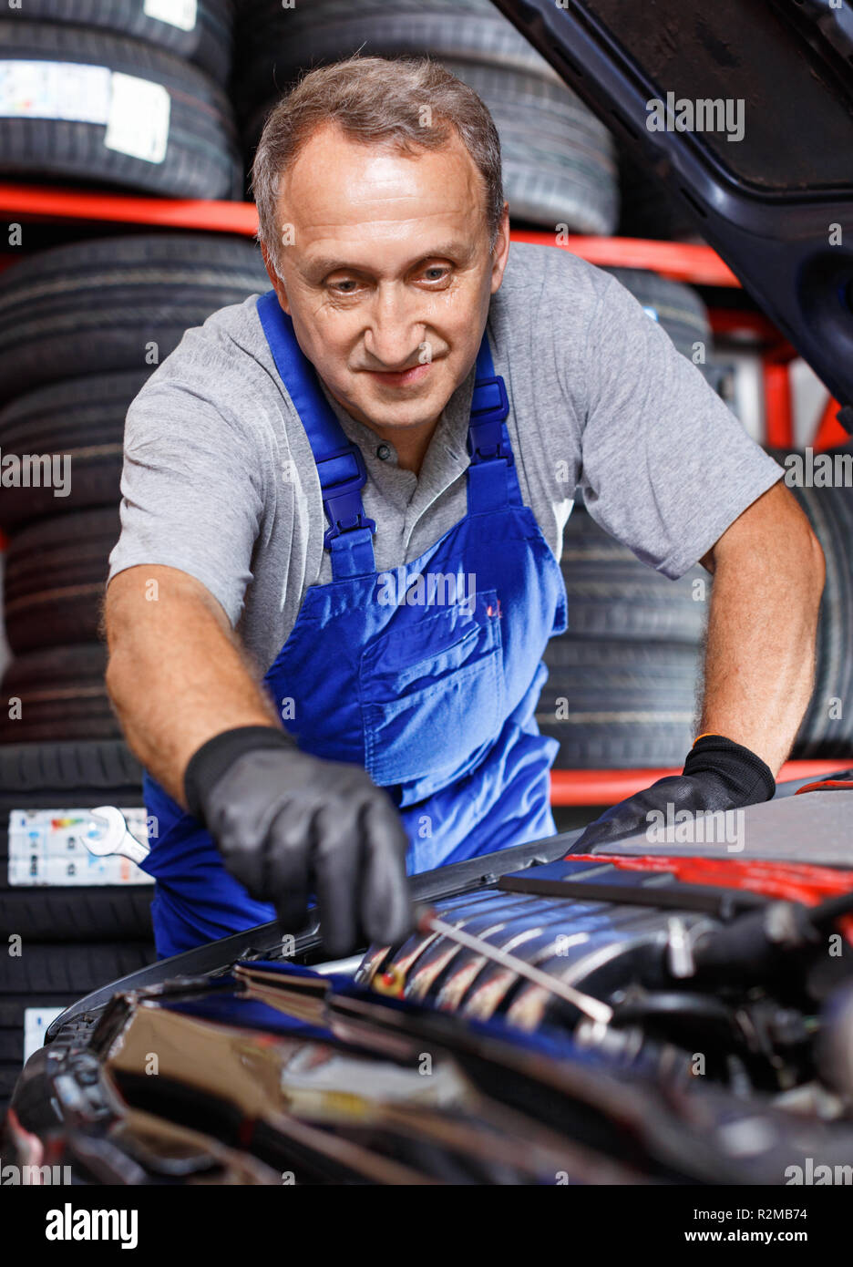 Professional mature cheerful positive smiling man car mechanician ...