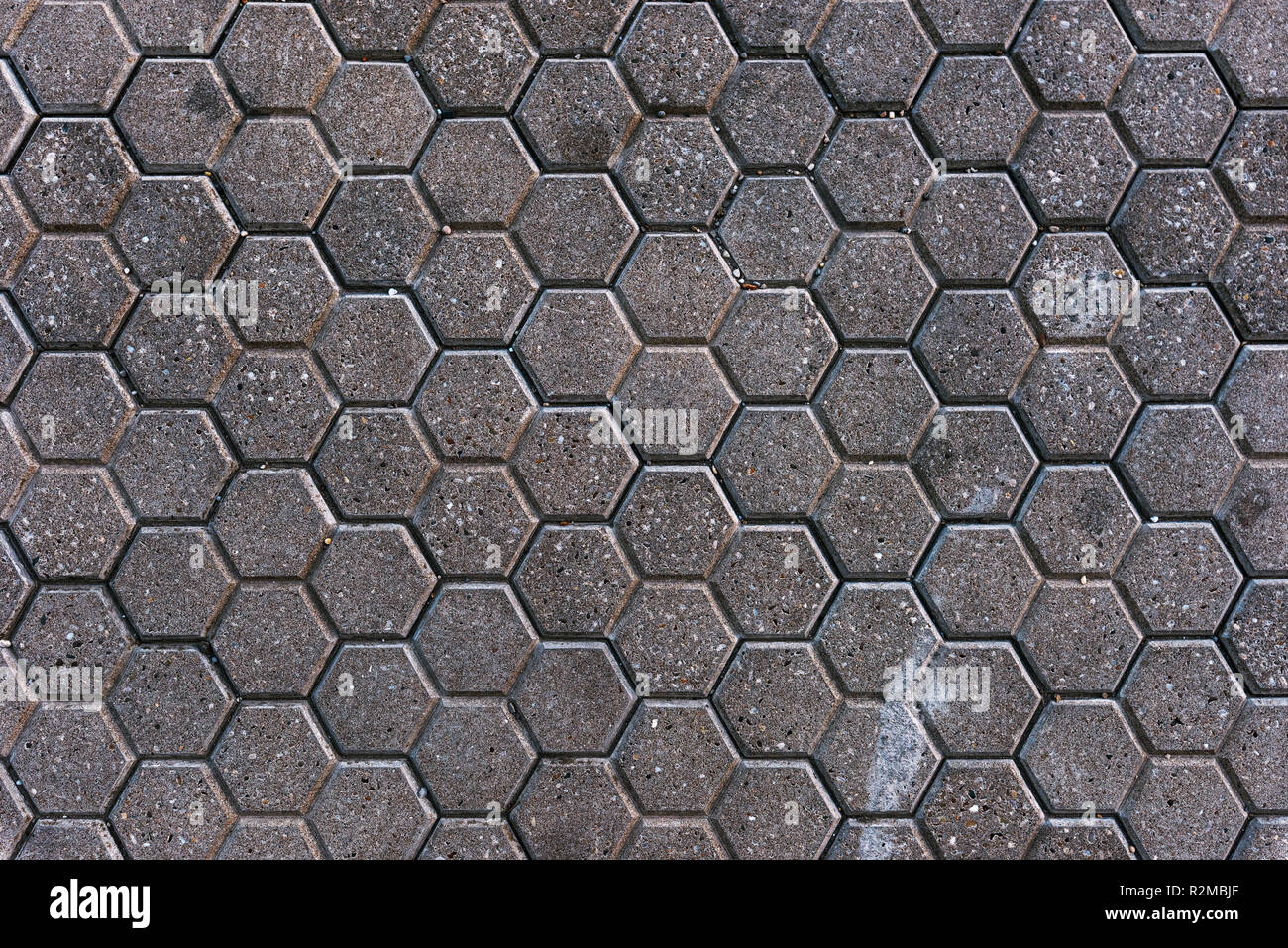 Hexagonal concrete pavement tiles background from above Stock Photo - Alamy