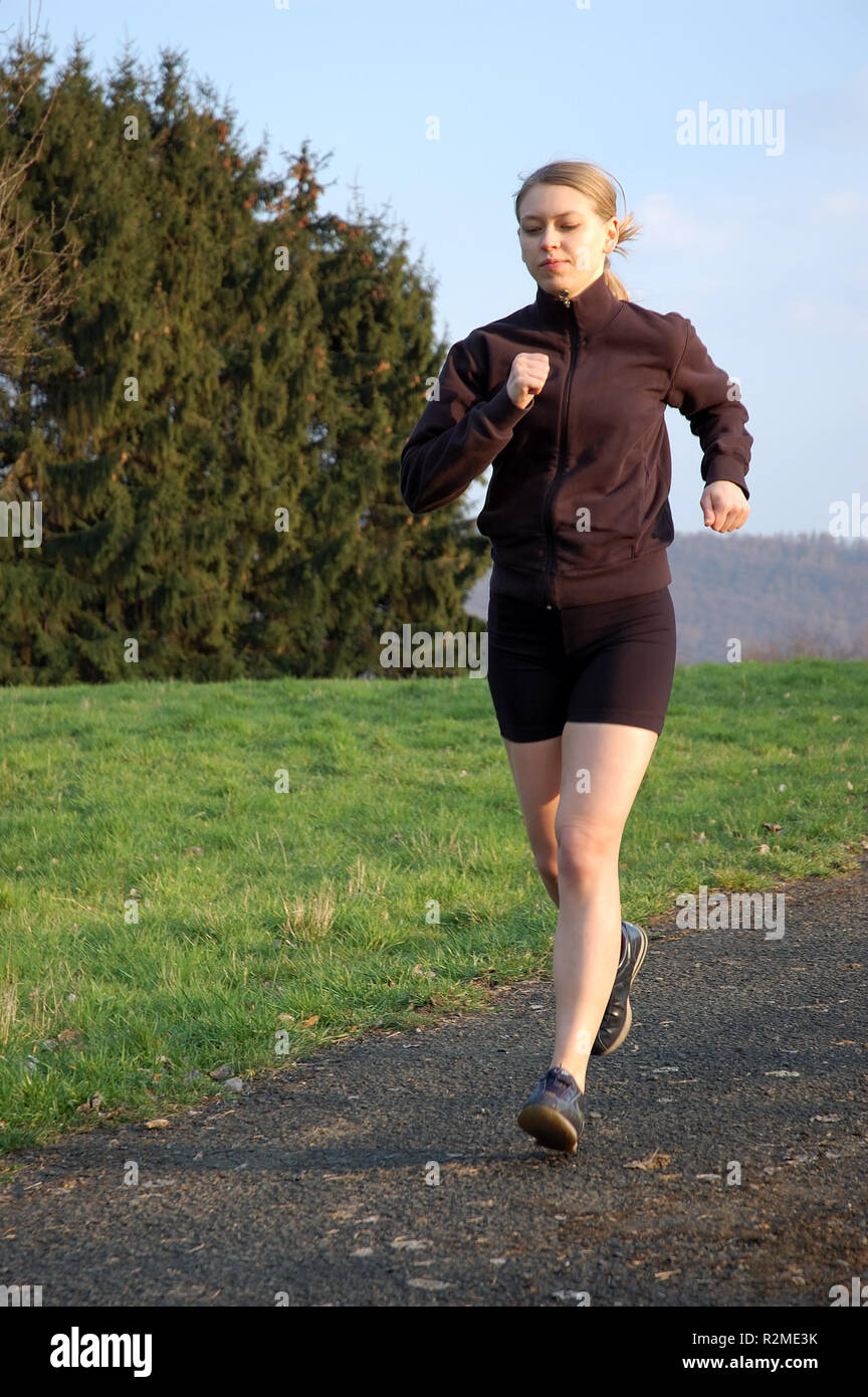 young woman jogging Stock Photo - Alamy