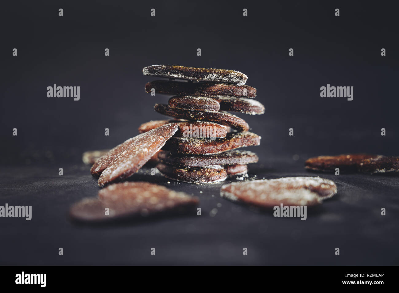 Closeup view of burned gingerbread cookies isolated on black background ...