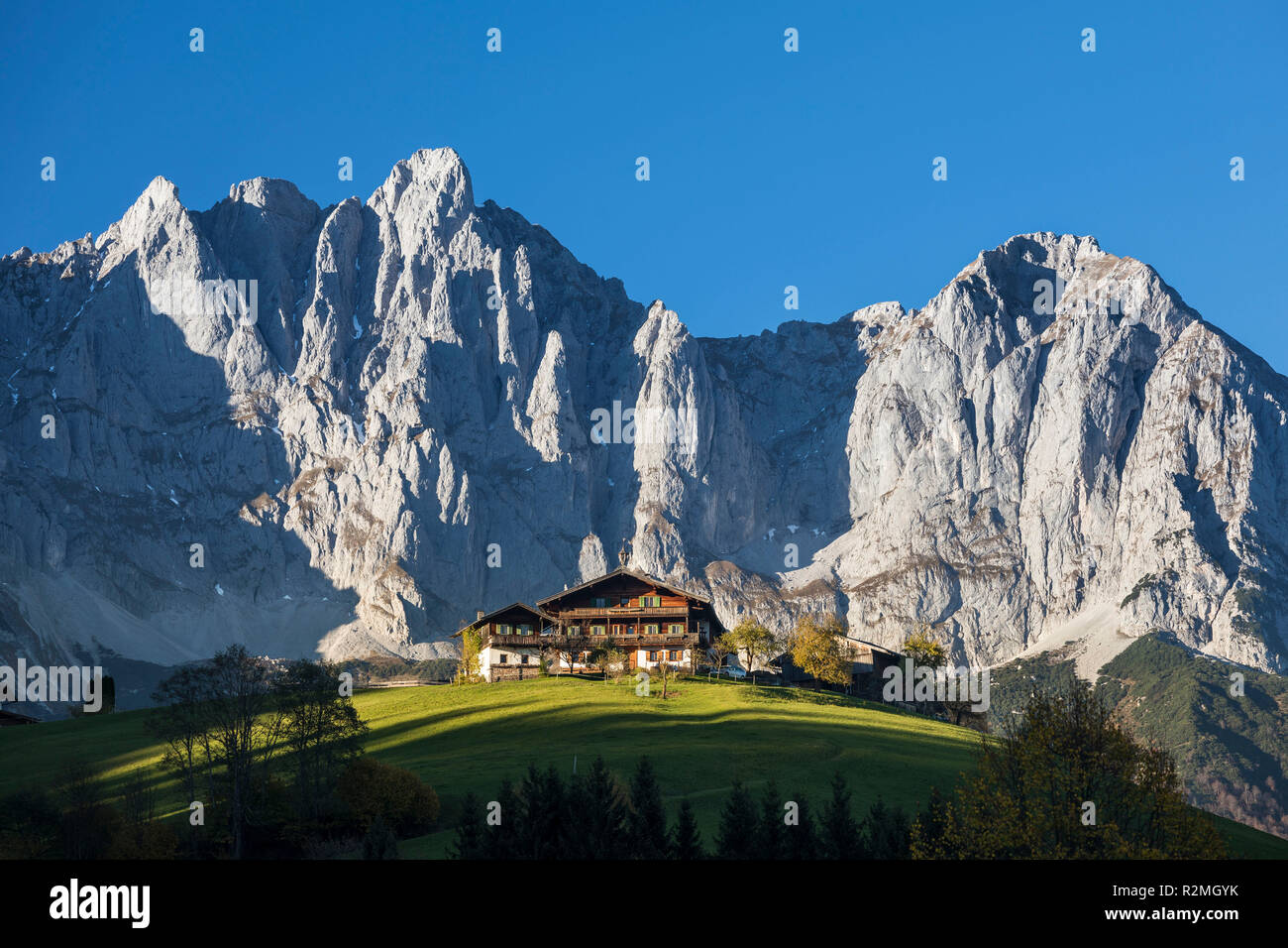 Tyrolean farmhouse in front of kaiser mountains hi-res stock ...
