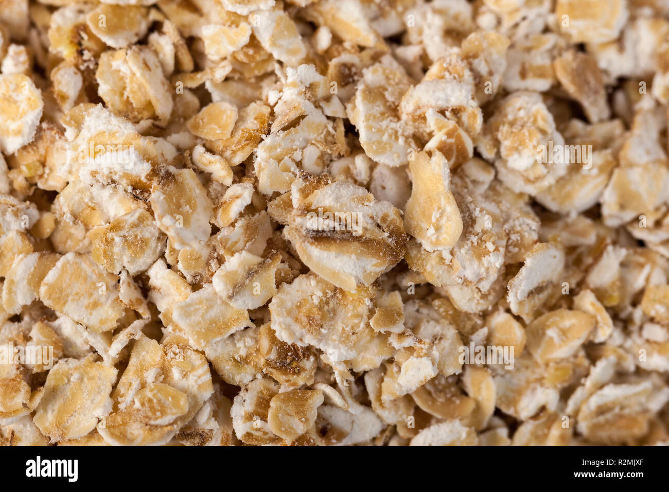 Rolled oats background. Organic oatmeal background texture, macro photo ...