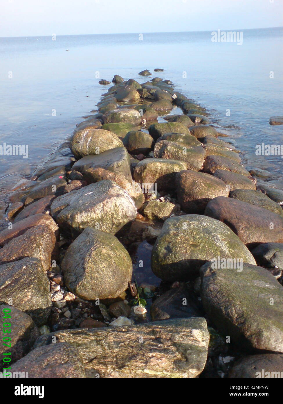 stones in sea Stock Photo - Alamy