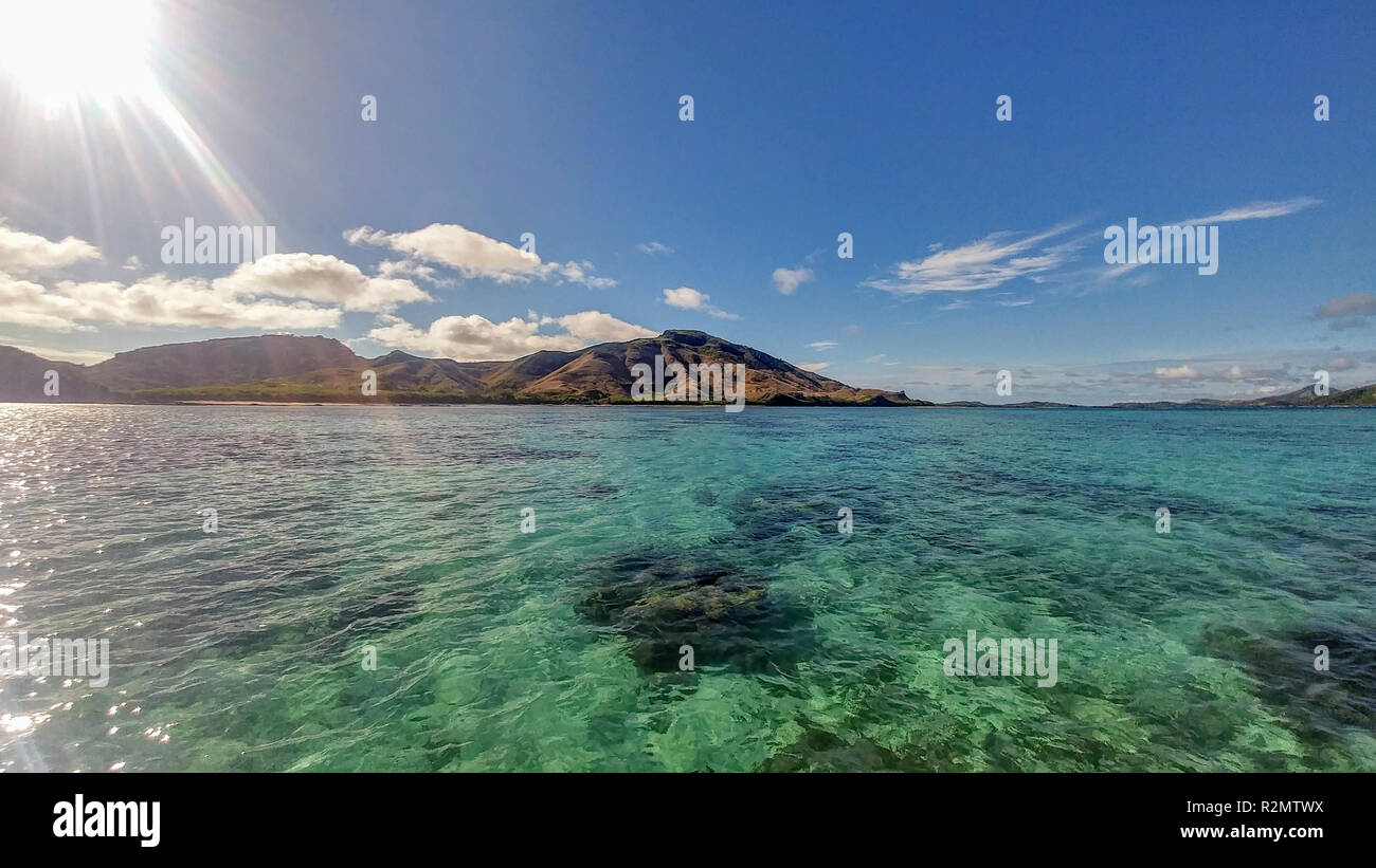 Island in the sea and mainland on the horizon, Fiji Stock Photo - Alamy