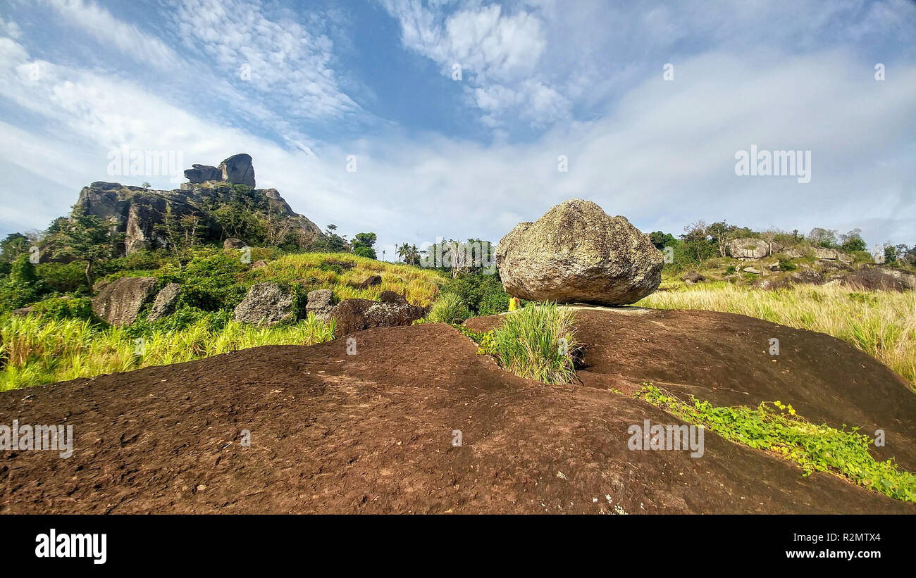 Rocks and stones surrounded by green field, Fiji Stock Photo - Alamy