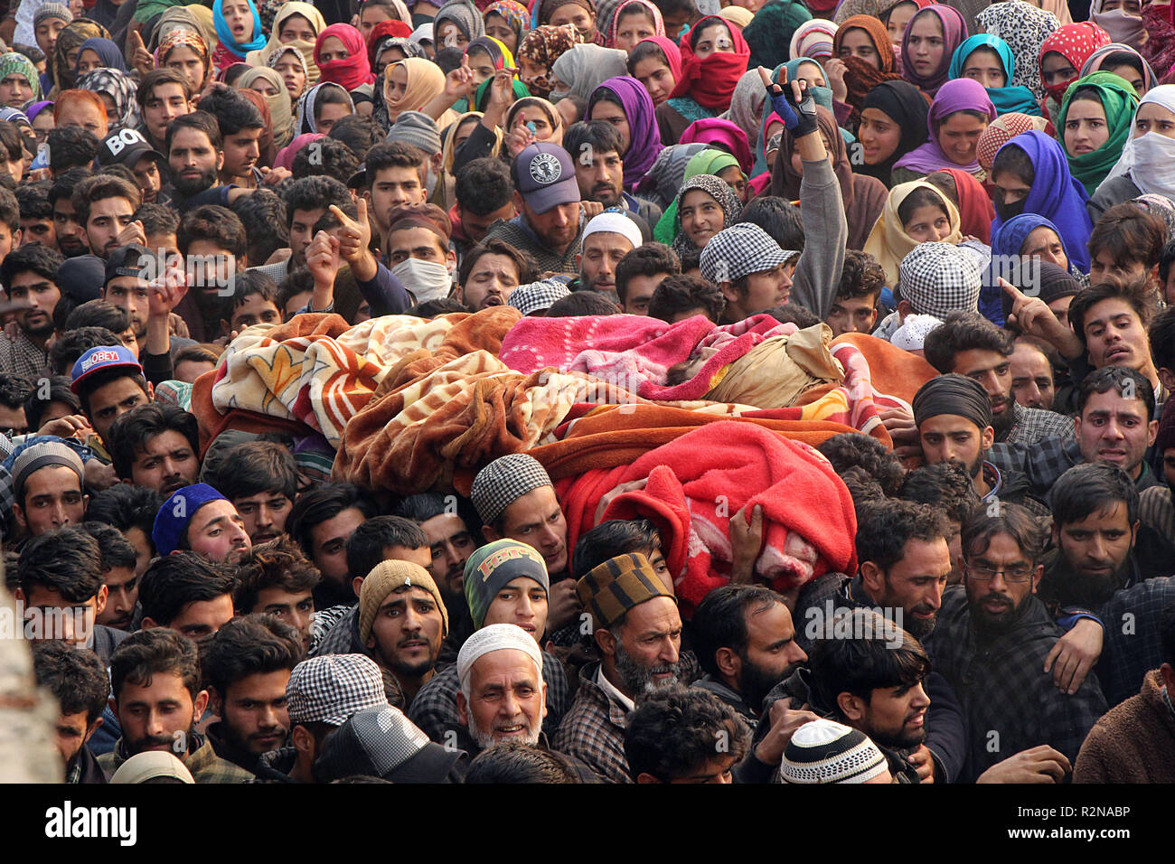 Shopian, Jammu and Kashmir, India. 20th Nov, 2018. People carry the ...