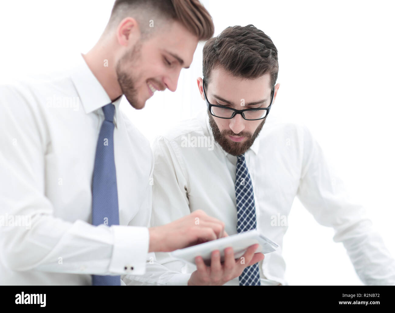 close up.two employees looking at the digital tablet screen Stock Photo ...