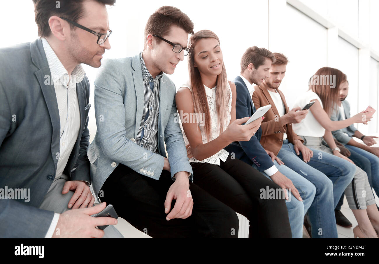 group of young people use their smartphones Stock Photo - Alamy