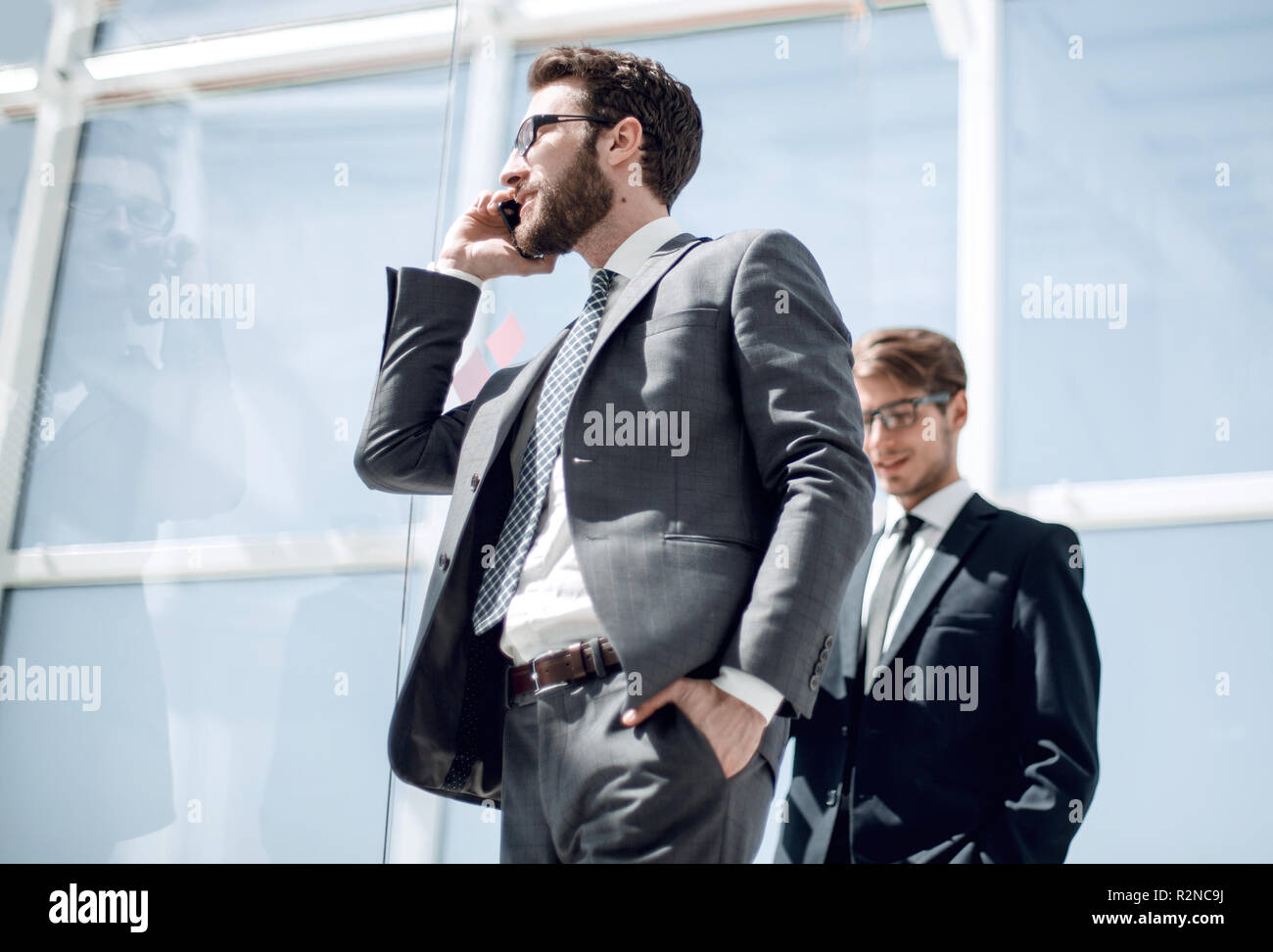 side view.business man talking on mobile phone Stock Photo - Alamy
