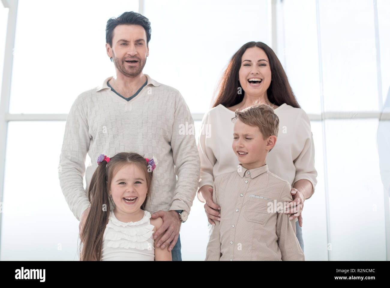 portrait of a happy family with small children Stock Photo - Alamy