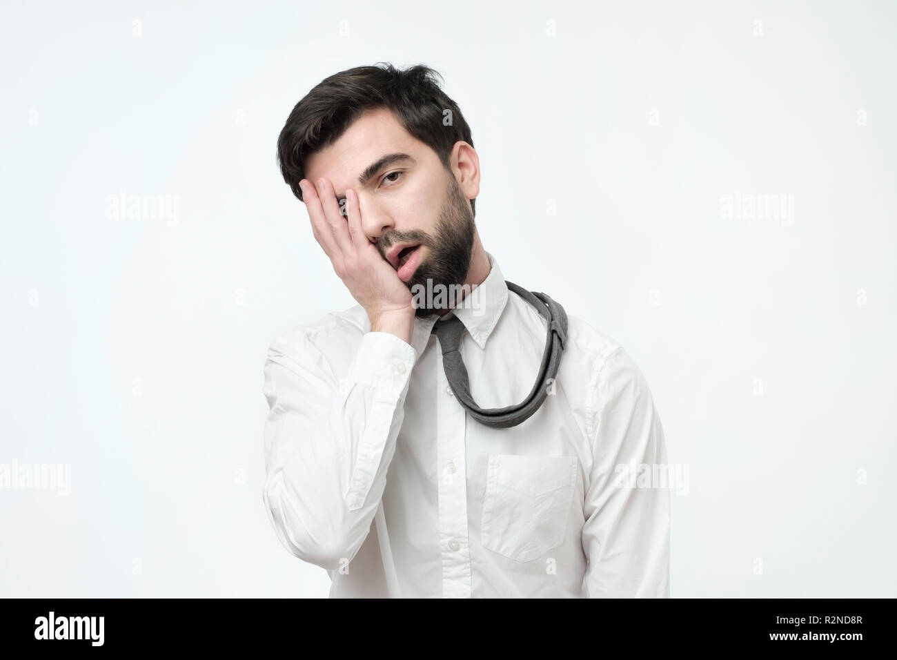 Overworked man has no strength, being sleepy and tired Stock Photo - Alamy