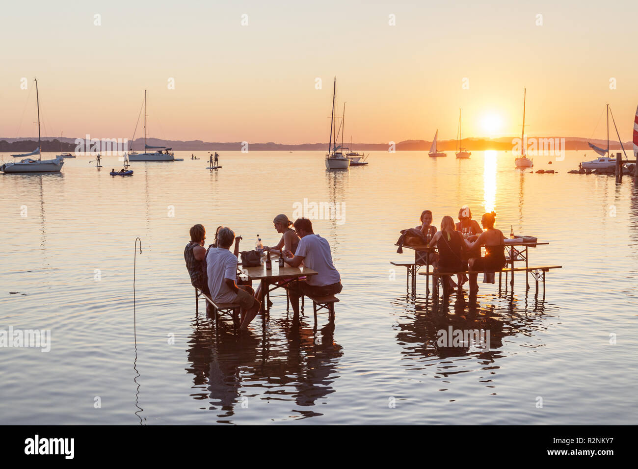 Tables in the water, sundowner bar in Übersee am Chiemsee, Chiemgau ...
