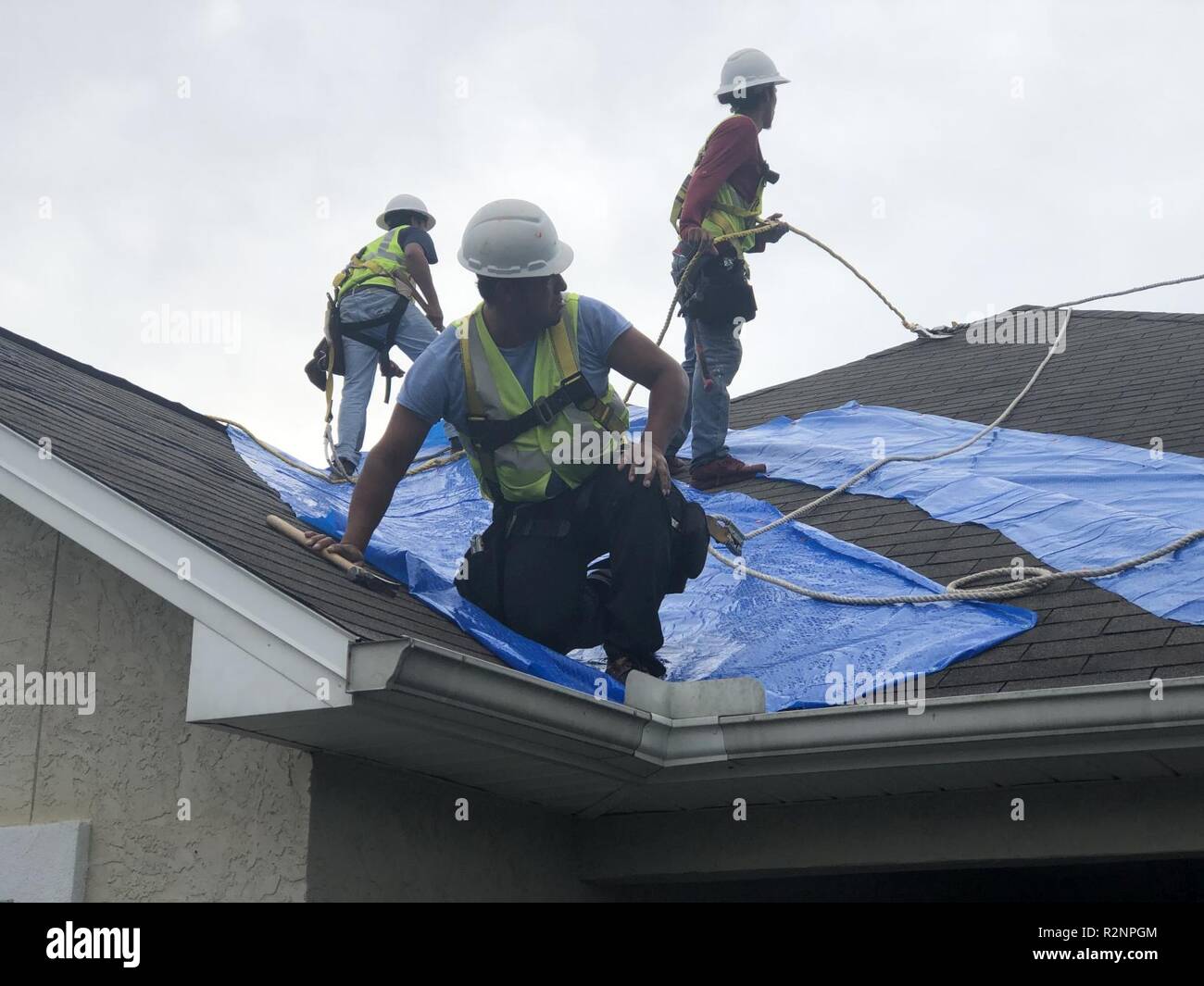 USACE contractors install reinforced plastic sheeting as part of the ...
