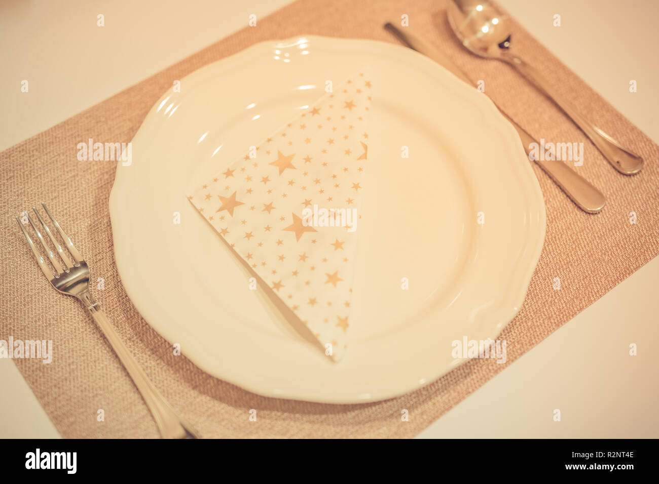 Holiday table place setting, top view. Vintage toned effect Stock Photo ...