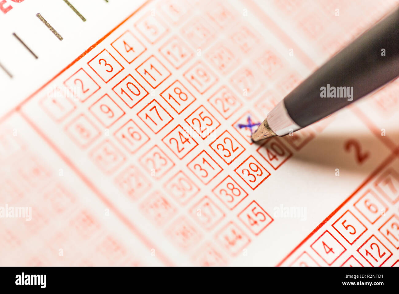 Close-up Of Person's Hand Marking Number On Lottery Ticket With Pen ...