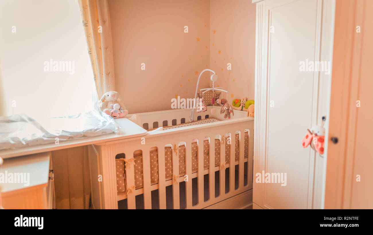 Interior of baby room indoors bed carpet, sunlight as high-key room ...