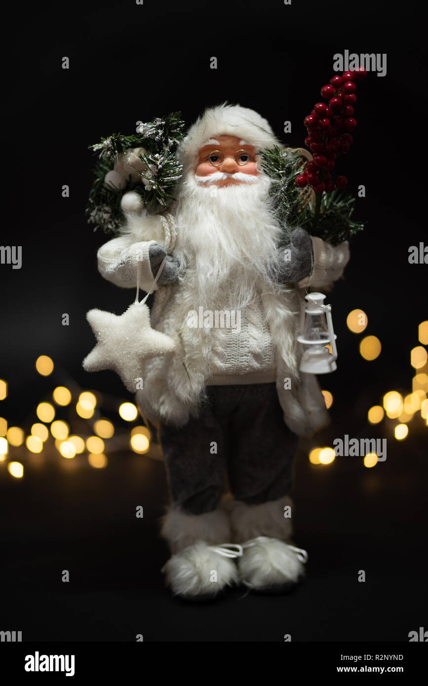Santa Claus shot against dark background with magical golden bokeh ...