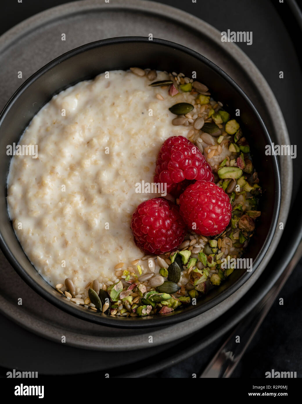 breakfast porridge in dark bowl Stock Photo - Alamy