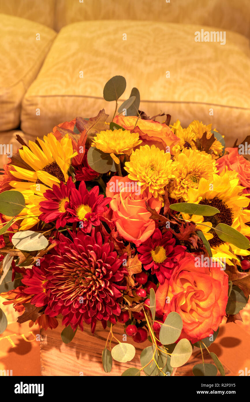 Fall colored flower bouquet that includes orange roses, yellow ...