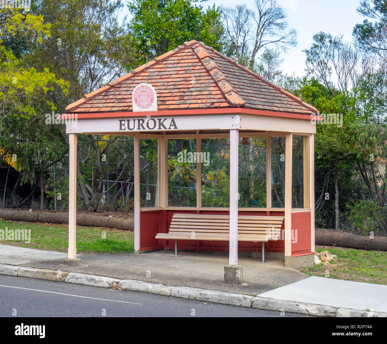 A wooden bench in a sheltered bus stop in suburb of Euroka, Sydney, NSW ...